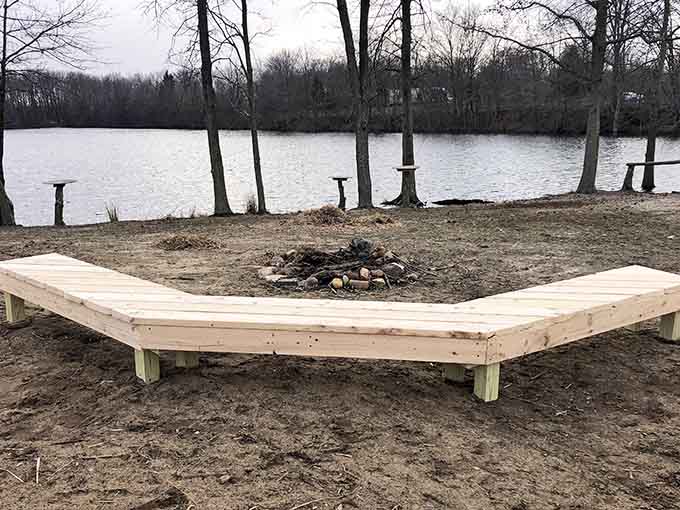 A lakeside fire pit and benches invite you to sit and contemplate why you don't visit farms more often.