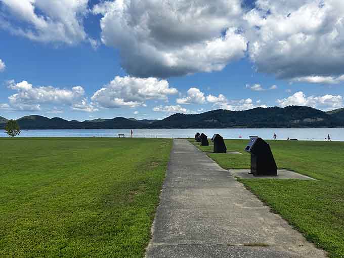 This lakeside path stretches toward mountain views that make you want to walk slowly and savor every single step forward.
