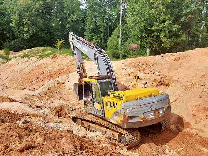 Heavy machinery does the hard work, exposing fresh layers of crystal-bearing earth for eager visitors daily.