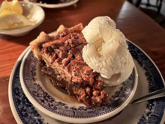 Pecan pie topped with vanilla ice cream because sometimes dessert requires both temperature extremes at once.