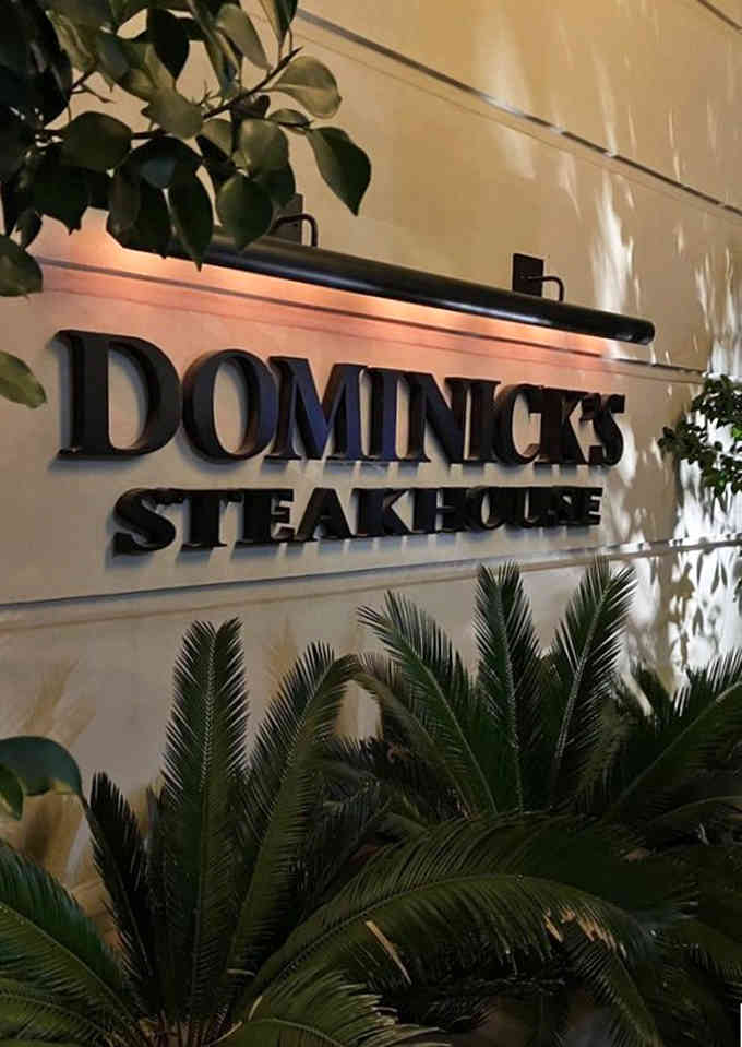 The Dominick's sign welcomes you with understated elegance, promising an evening of exceptional food in equally exceptional surroundings.