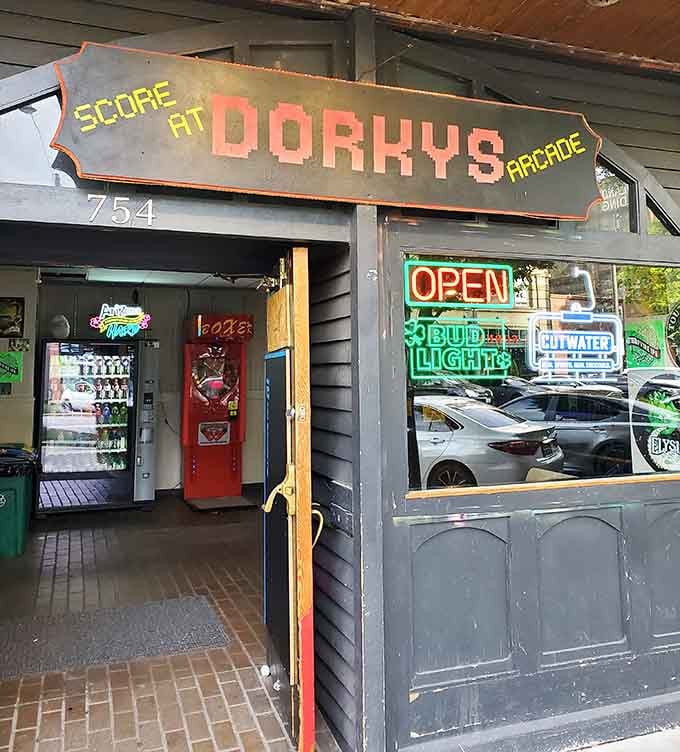 The exterior promises retro gaming paradise, and that "Score At" sign isn't lying about what awaits inside these walls.