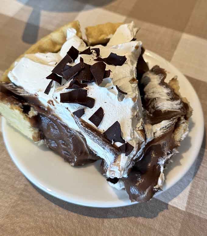 Chocolate cream pie topped with shaved chocolate curls, because regular pie is for people without ambition or appetite.