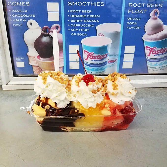 Three scoops, three sauces, whipped cream, nuts, and a cherry create the banana split of your childhood dreams realized.