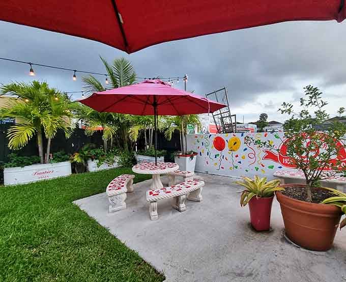A little slice of outdoor paradise where you can enjoy your pizza under Miami skies and palm trees.