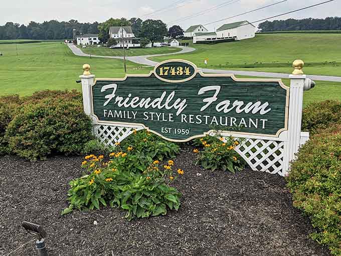 This roadside sign marks the spot where sensible eating plans go to die, and nobody seems particularly upset about it.