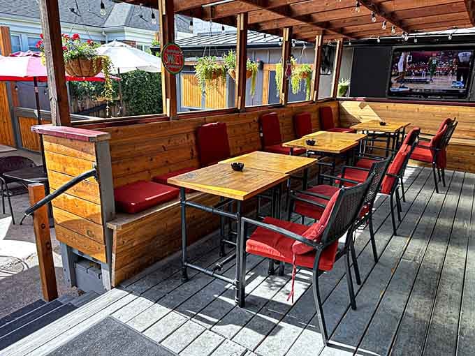 The covered patio with wooden tables offers fresh air dining without sacrificing any of that tavern charm.