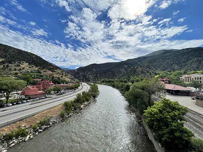 The Colorado River flowing past, completely unaware it's photobombing your perfect hot springs moment.