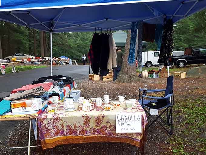 A vendor's setup showcasing everything from teacups to candles, proving one person's attic cleanout is another's shopping paradise.