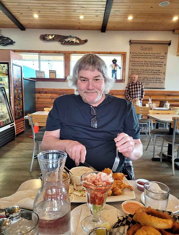 Pure contentment captured mid-meal, the universal expression of someone who made exactly the right restaurant choice today.