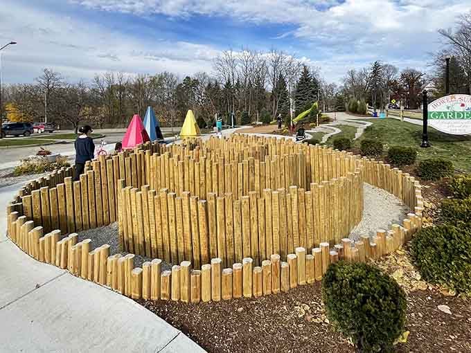 Wooden spiral installations and colorful garden accents show someone's been thinking creatively about outdoor spaces and community gathering.