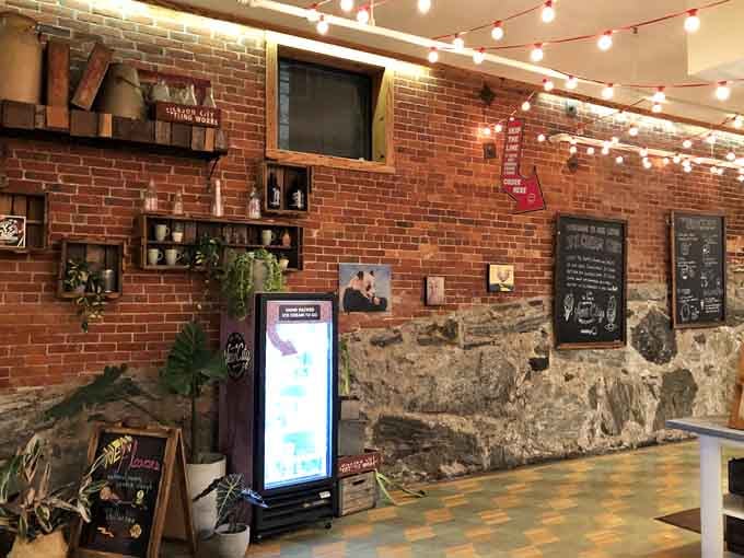 Exposed brick and cozy corners create the kind of atmosphere that makes lingering feel mandatory.
