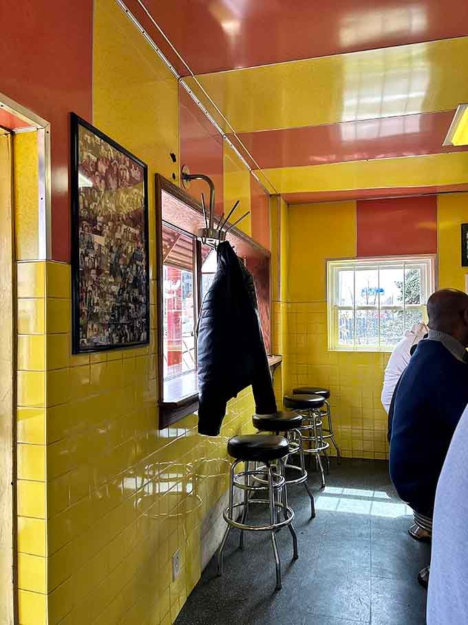 More of that cheerful yellow tile and vintage phone, transporting you to when diners were community gathering spots.