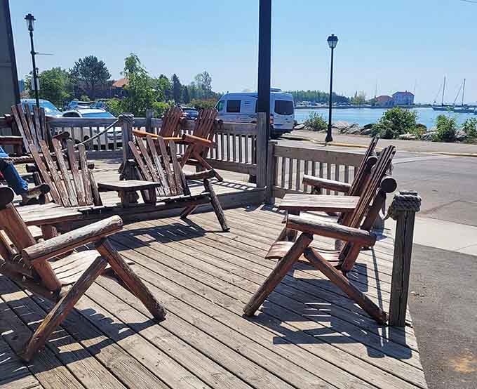 Adirondack chairs facing the harbor, where your coffee break becomes a legitimate Lake Superior meditation session.