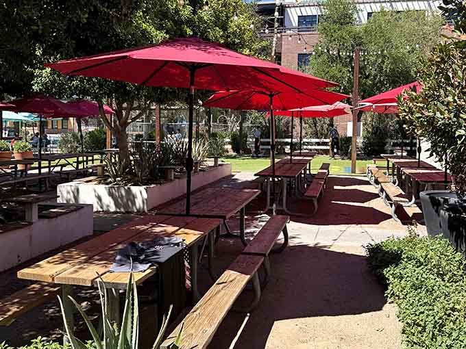 Shaded outdoor seating lets you enjoy Arizona weather while devouring ribs under bright red umbrellas.