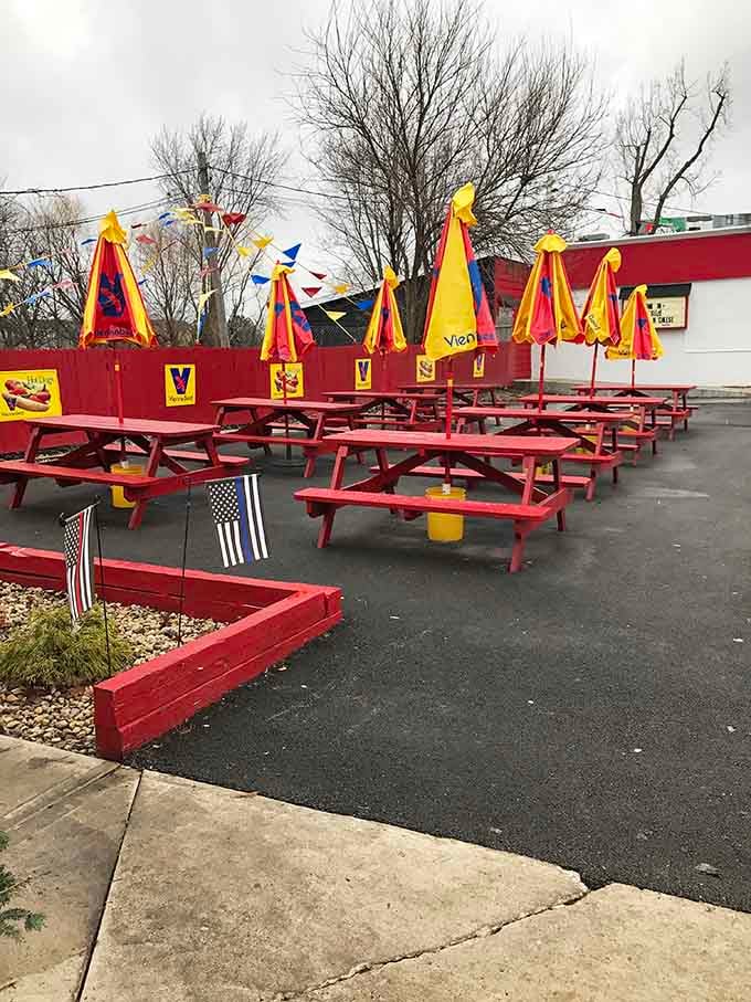 Red picnic tables lined up and ready for crowds show this place knows how to handle the lunch rush with style.