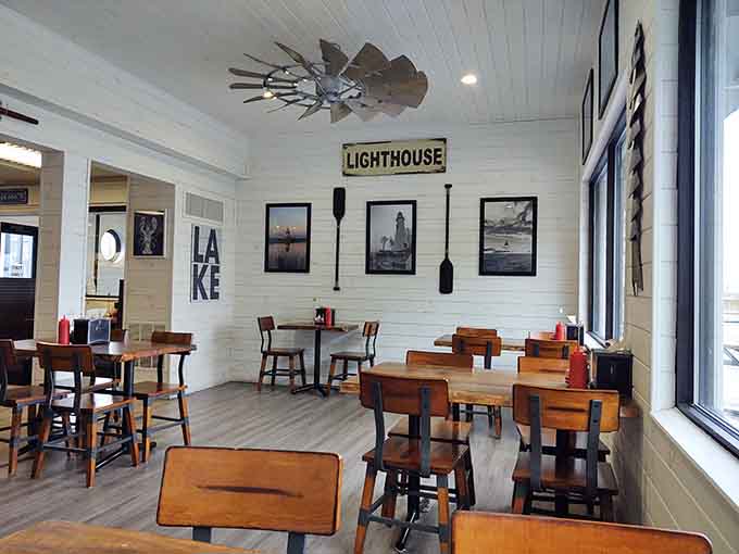 The lighthouse sign and lake-themed decor remind you exactly where your delicious dinner came from this morning.