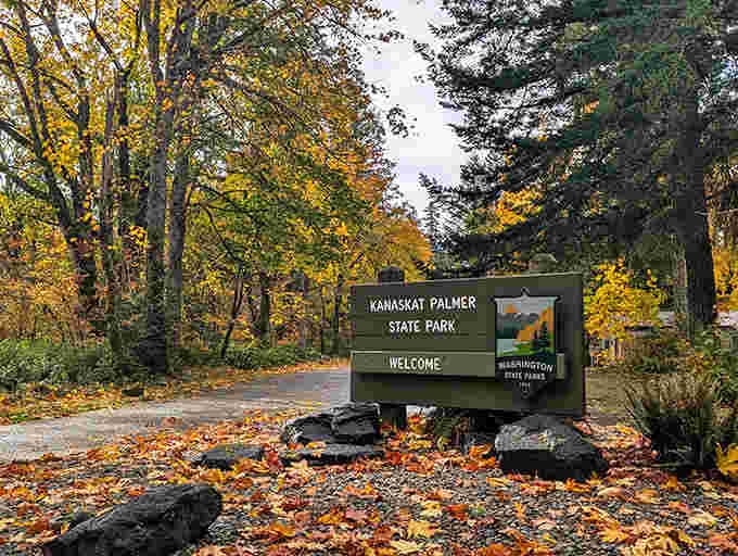 The welcome sign greets visitors with fall foliage, nature's way of rolling out the red carpet.