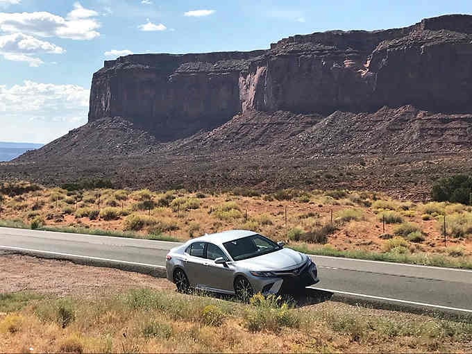 That silver sedan knows what's up: when views look this good, pulling over isn't optional anymore.
