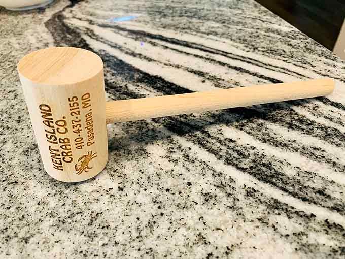 The wooden mallet and cup, simple tools that transform crab picking from dinner into a beloved Maryland meditation practice.