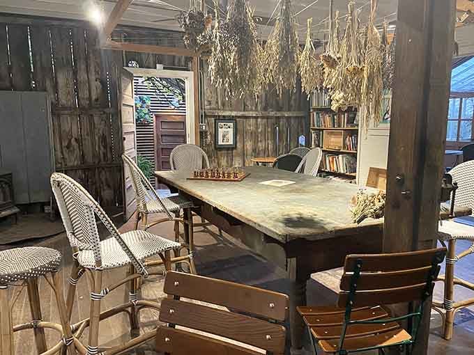Even the rustic shed with its chess set and dried flowers feels like someone's carefully curated vision of peaceful dining.