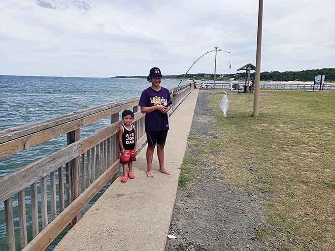 Young anglers learn patience and persistence on the fishing pier, creating memories that outlast any catch.