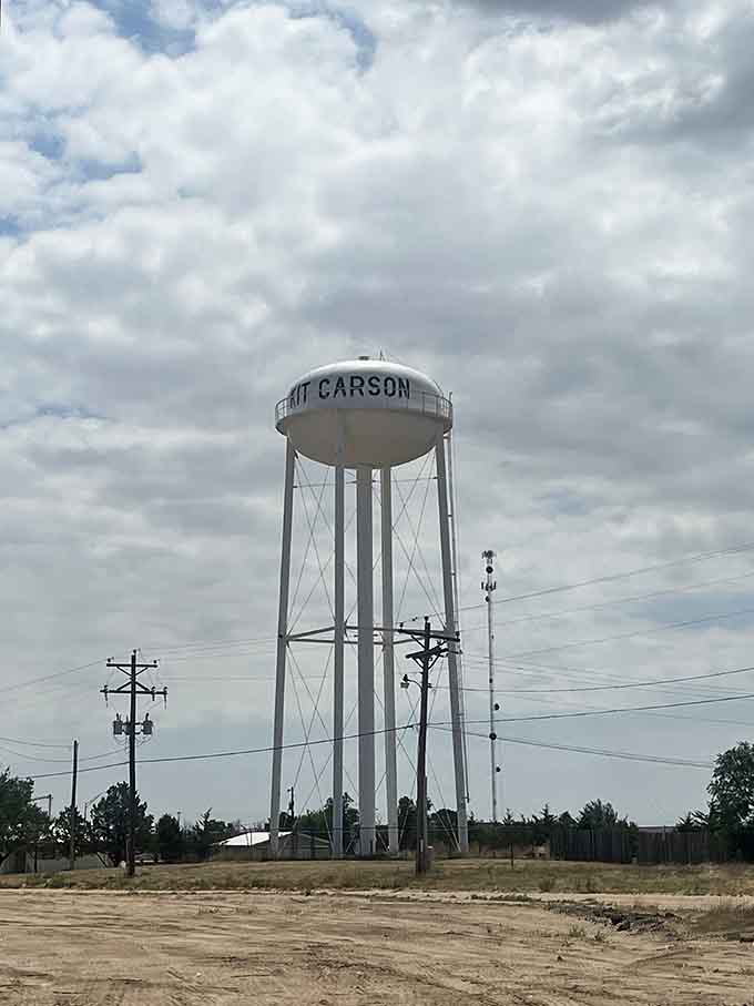 The water tower stands sentinel over town, a landmark visible for miles across the flat landscape.