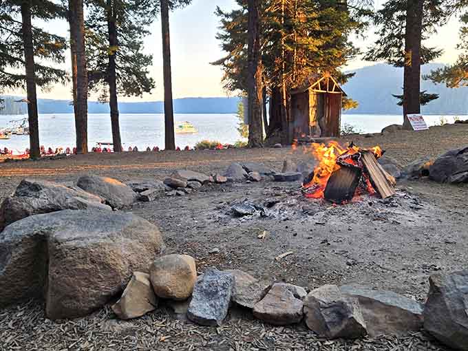 Lakeside campfires at sunset create memories that cost practically nothing but deliver priceless moments of pure peace.