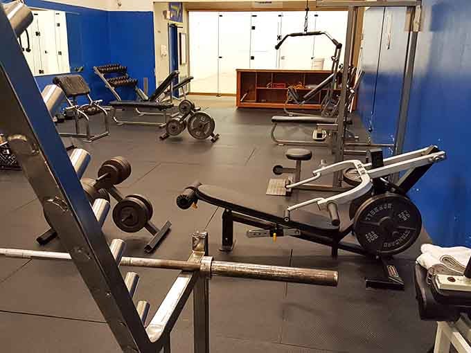 The fitness center where you can pretend vacation calories count while staring at actual exercise equipment.