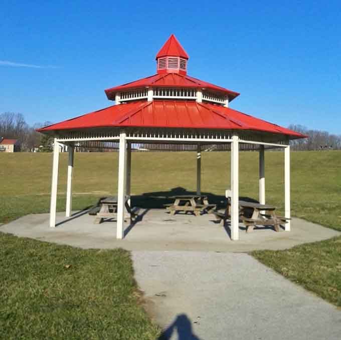That red-roofed gazebo stands ready for picnics, proposals, or simply escaping a sudden Maryland rain shower.