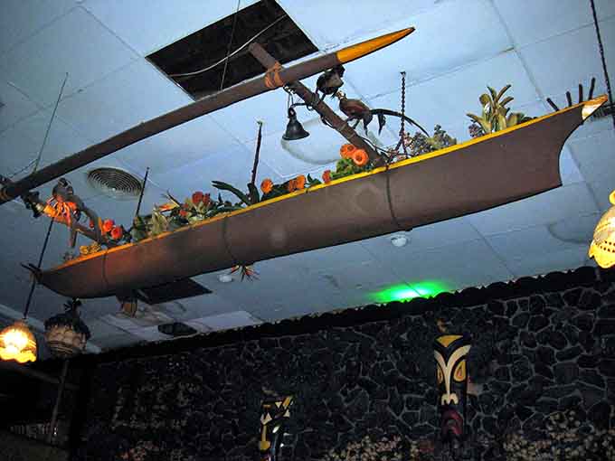 An outrigger canoe suspended from the ceiling reminds you that this place doesn't believe in doing anything halfway.