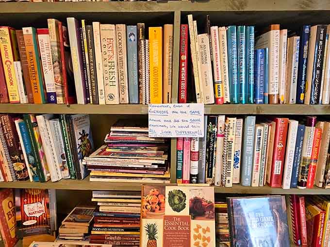 Cookbook shelves organized by someone who clearly believes recipes and reading belong together in perfect harmony.