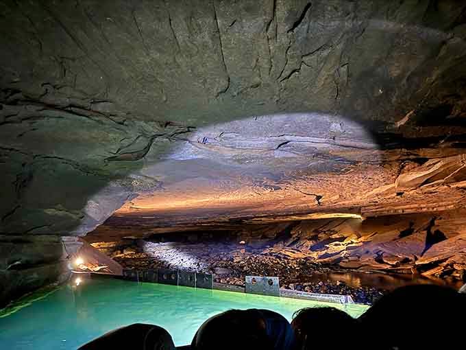 Narrow passages reveal the cave's intimate spaces where limestone walls seem close enough to whisper secrets.