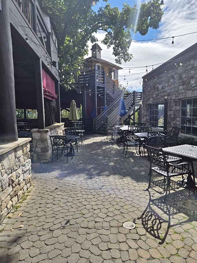 Outdoor seating with cobblestones and fresh air turns a regular meal into a proper dining experience worth savoring.
