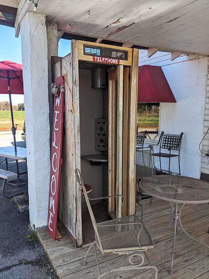An actual vintage phone booth stands guard, reminding us when calling ahead meant something entirely different.