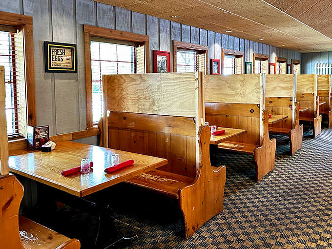 Wooden booths that feel like your own private dining room, perfect for settling in long-term.