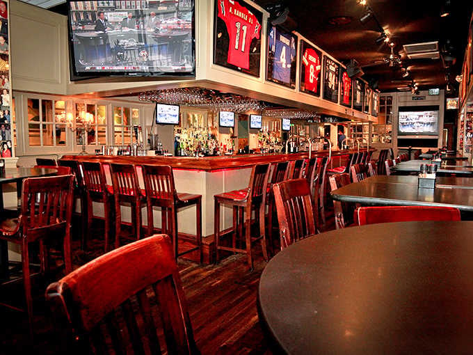 The bar stretches invitingly, lined with red stools and enough TVs to catch the game while enjoying fresh catch.