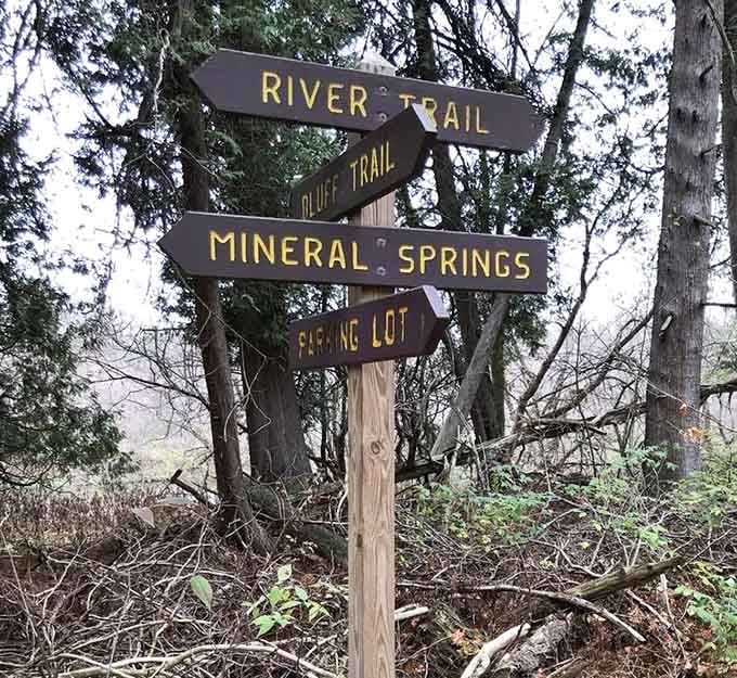 Trail signs point you toward mineral springs and river paths, each direction promising its own adventure. 