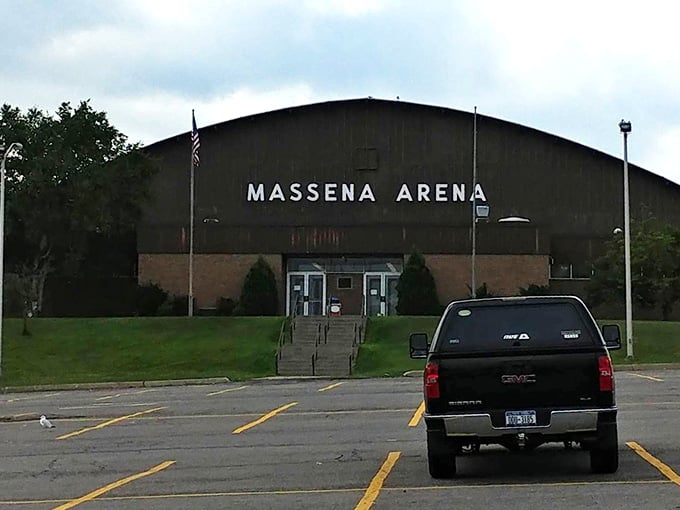 The Massena Arena stands solid and unpretentious, hosting hockey games where tickets cost less than parking elsewhere.
