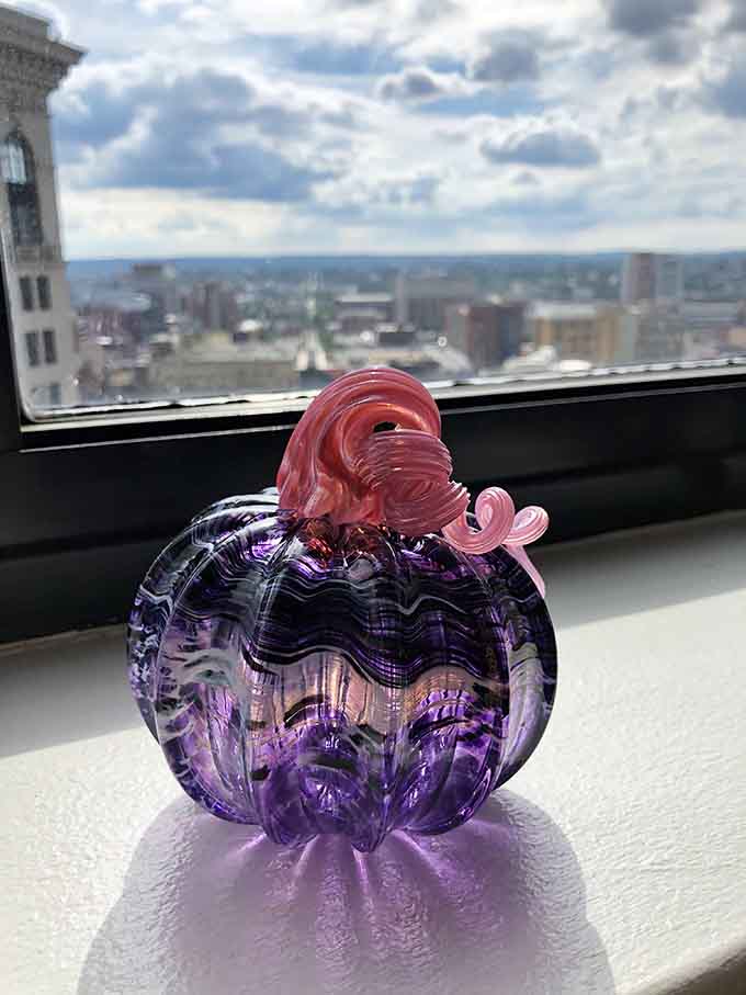 A purple pumpkin with pink flourishes proves Halloween decorations can be elegant, artistic, and absolutely show-stopping year-round.