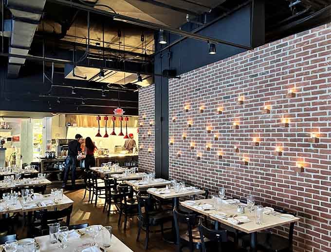 The dining room hums with energy as the open kitchen works its magic, turning quality ingredients into memorable meals.