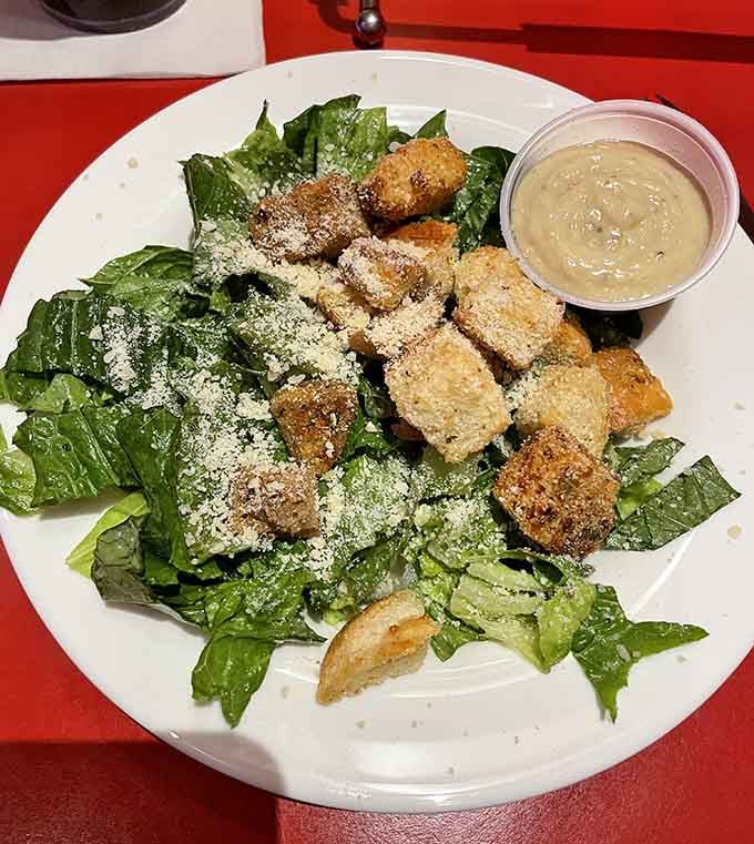 A Caesar salad so generous with toppings, it's practically showing off for the camera.
