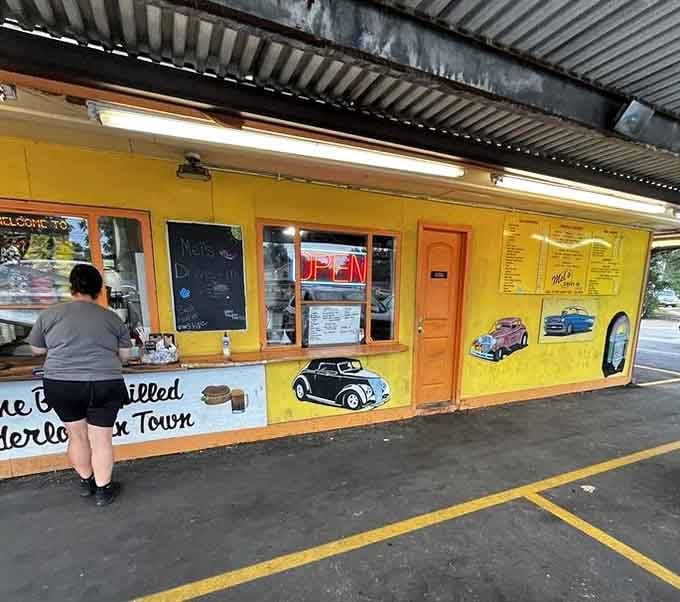 A satisfied customer placing an order, about to experience what locals have known about for years: Mel's delivers.