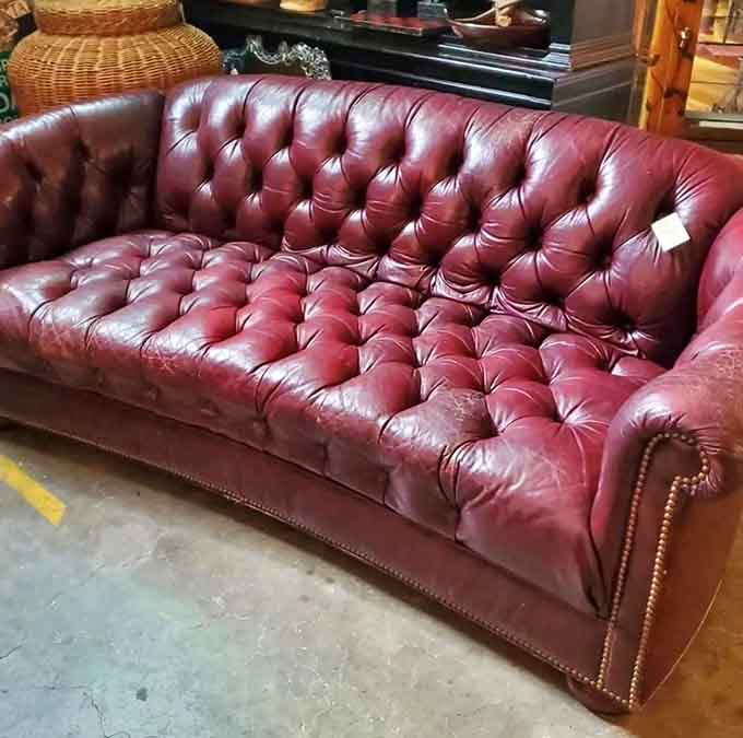 Tufted leather Chesterfield sofa that's survived decades looking this good, unlike your last relationship or IKEA purchase.