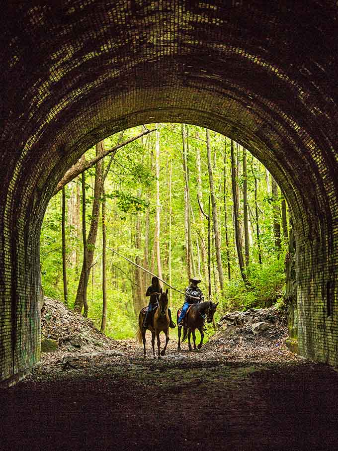 Horseback riders emerge from the darkness like something from a Western film, adding another layer of atmosphere to this legendary spot.