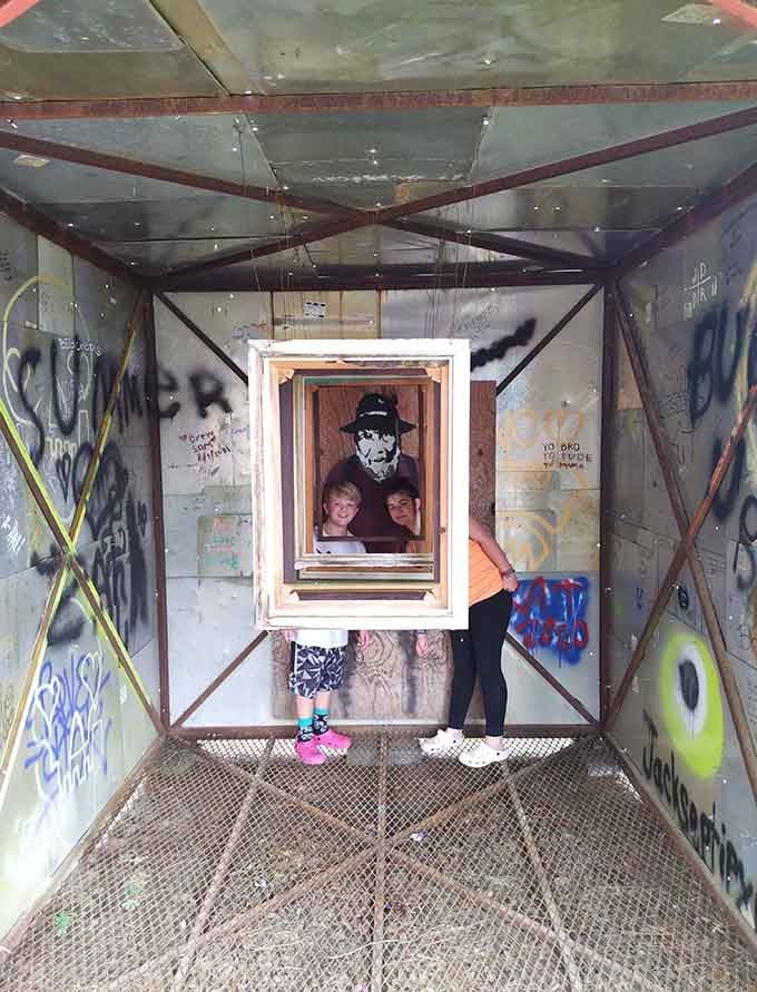 Layered frames and portraits create a kaleidoscope effect, turning a simple shipping container into an immersive gallery space worth exploring.