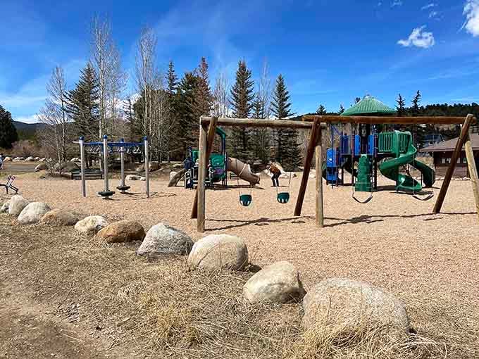 Chipeta Park's playground sits surrounded by pines, where kids play at elevation and parents enjoy the view.
