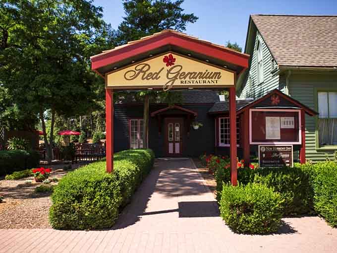 The Red Geranium's charming entrance promises sophisticated dining that'll make you forget you're in a town of 800.