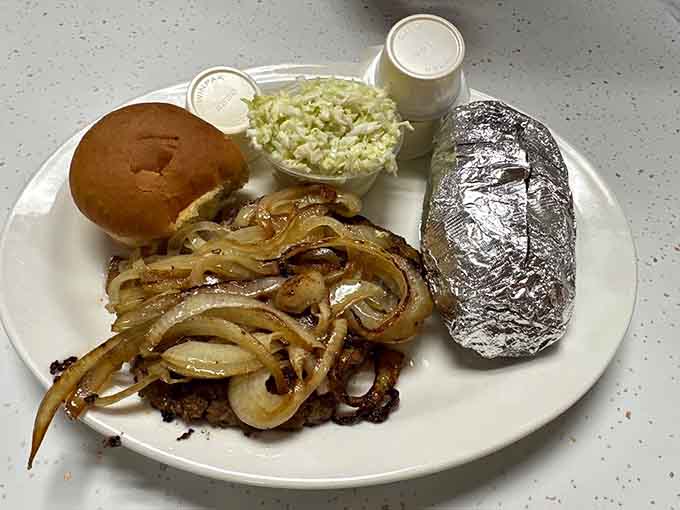 That perfectly grilled hamburger steak with all the fixings shows respect for folks who aren't catfish converts yet.