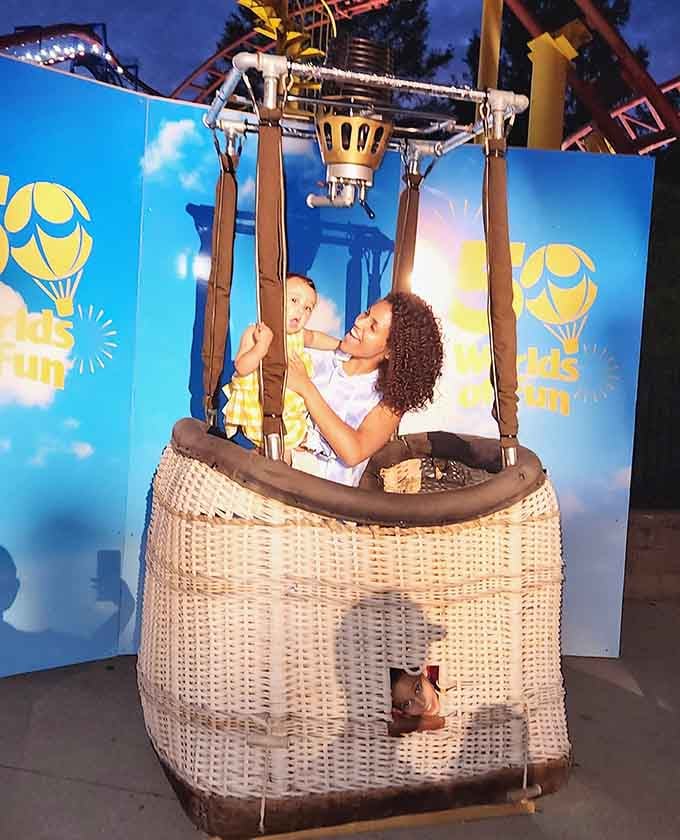 This whimsical hot air balloon photo booth captures the joy before gravity reminds you what goes up eventually comes down.
